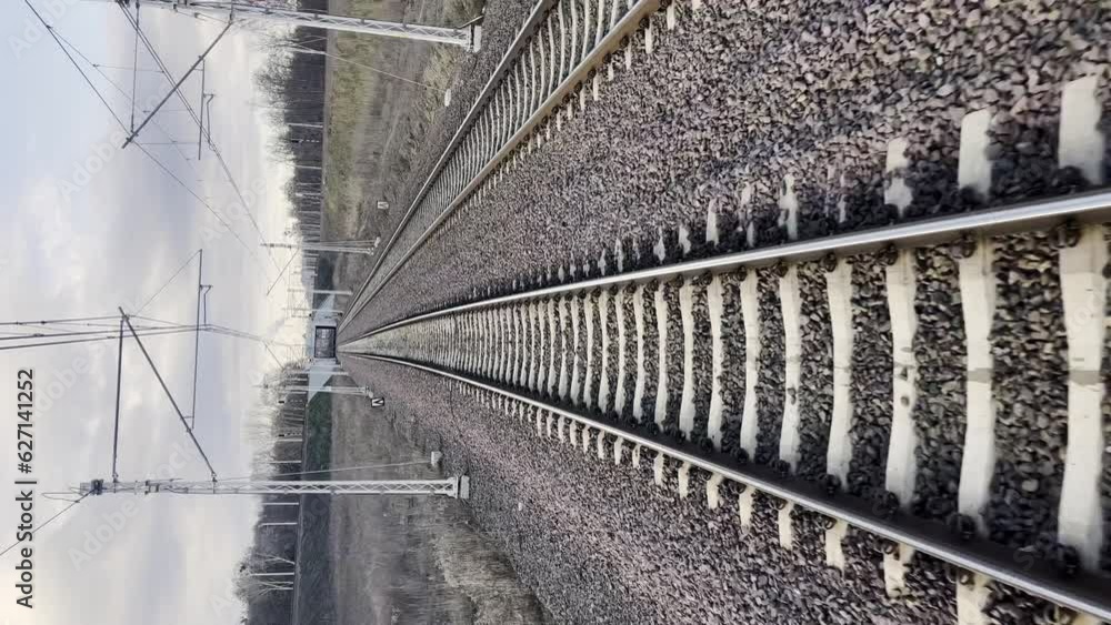 Vidéo Stock Vertical View on railroad track from the back window of ...