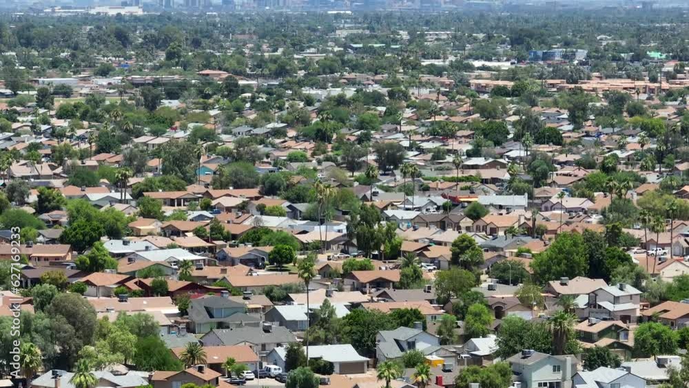 Sprawling neighborhoods in suburb of large American city. Aerial tilt ...