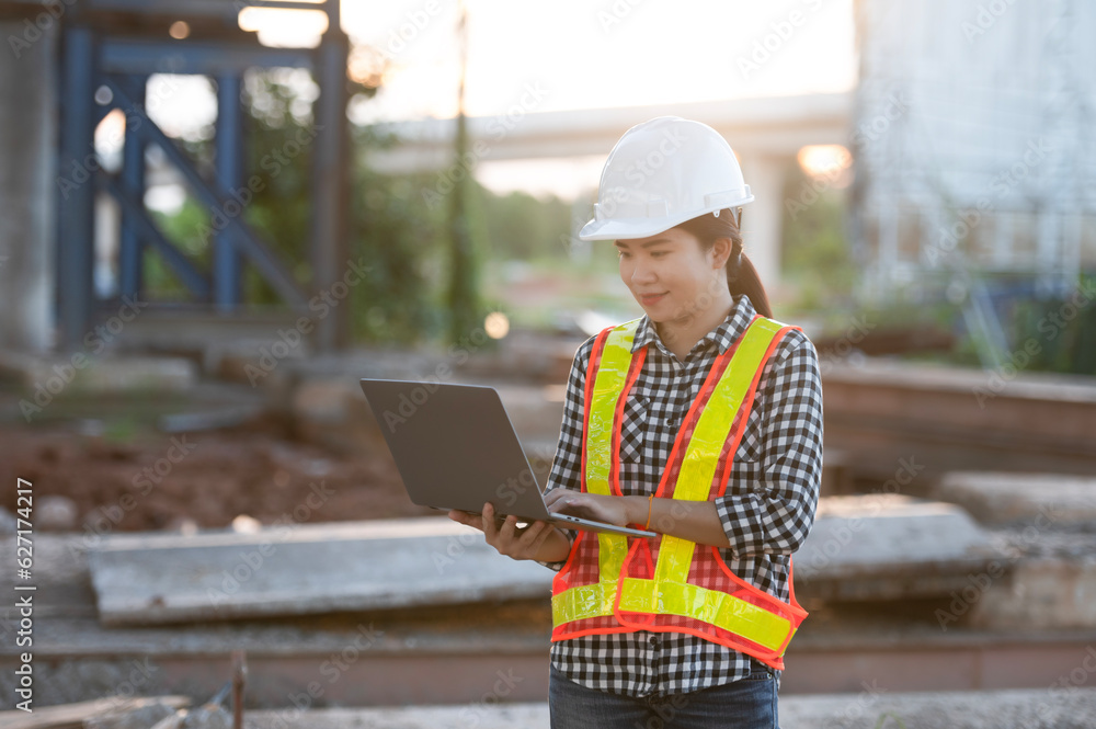 construction engineer Asian female architect with tablet computer at ...