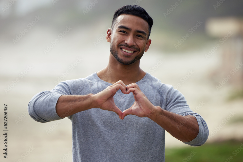 Portrait of happy man, heart and hand outdoor for care, kindness and ...