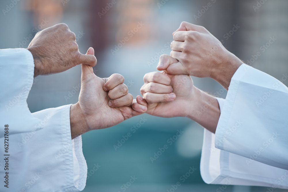 Foto de Hands, karate and grip with sports people fighting outdoor in a ...