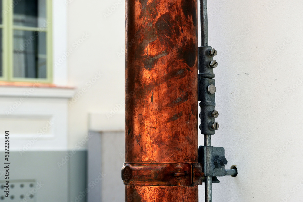 shiny new copper rain water leader, downspout or down pipe detail ...