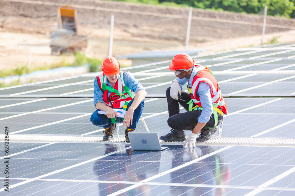 Architectural engineering team working on solar panels and his ...