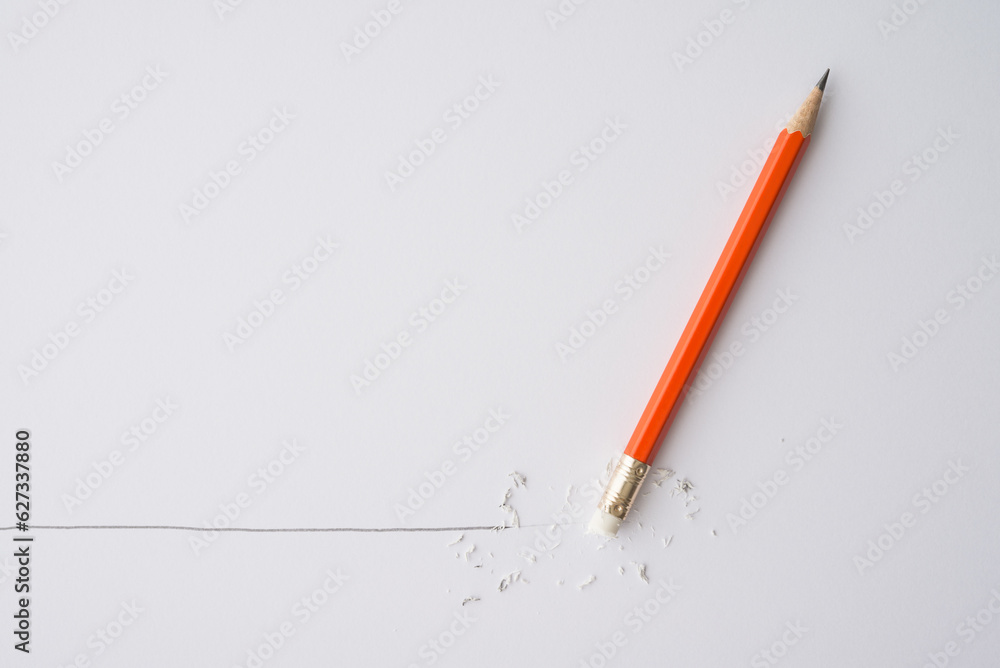 Flat lay of pencil eraser delete black line pencil on white paper ...