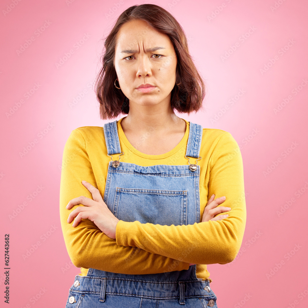 Portrait, frown and angry asian woman with arms crossed in studio and ...