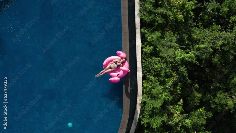 Top aerial view of young passion female tourist in bikini lies on ...