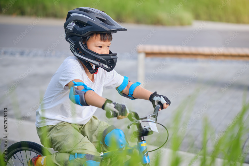 Cute little 7 years old school boy child in safety helmet wearing knee ...