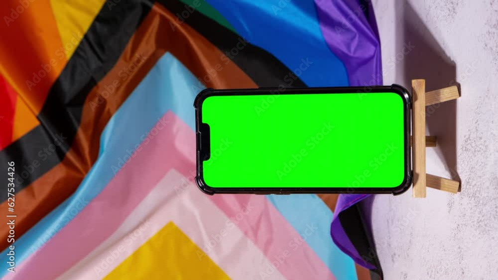 Vertical Zoom in out Mobile phone with chroma key on Rainbow LGBTQIA ...