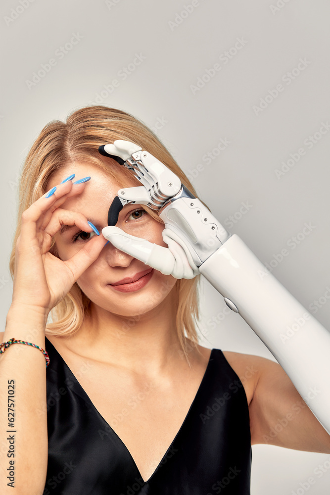 Close up of young charming girl with disability wearing sensory bionic ...