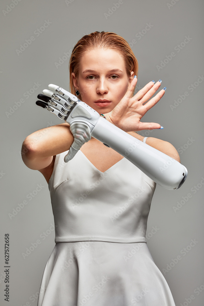 Studio portrait of beautiful young girl with disability wearing sensory ...