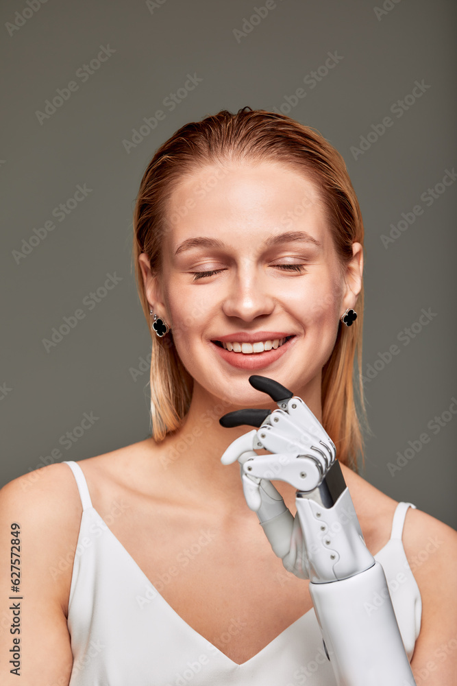 Close up studio portrait of charming young girl in white dress wearing ...