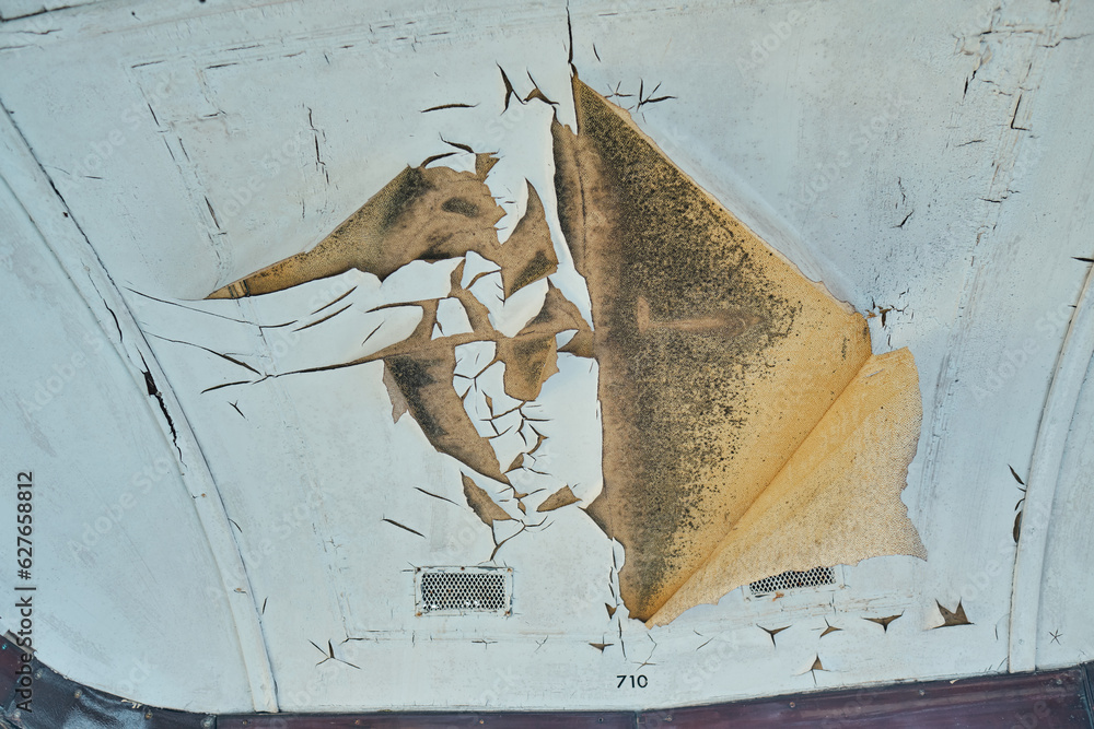 Decaying interior ceiling of an Old forgotten rusty Blackpool tram ...