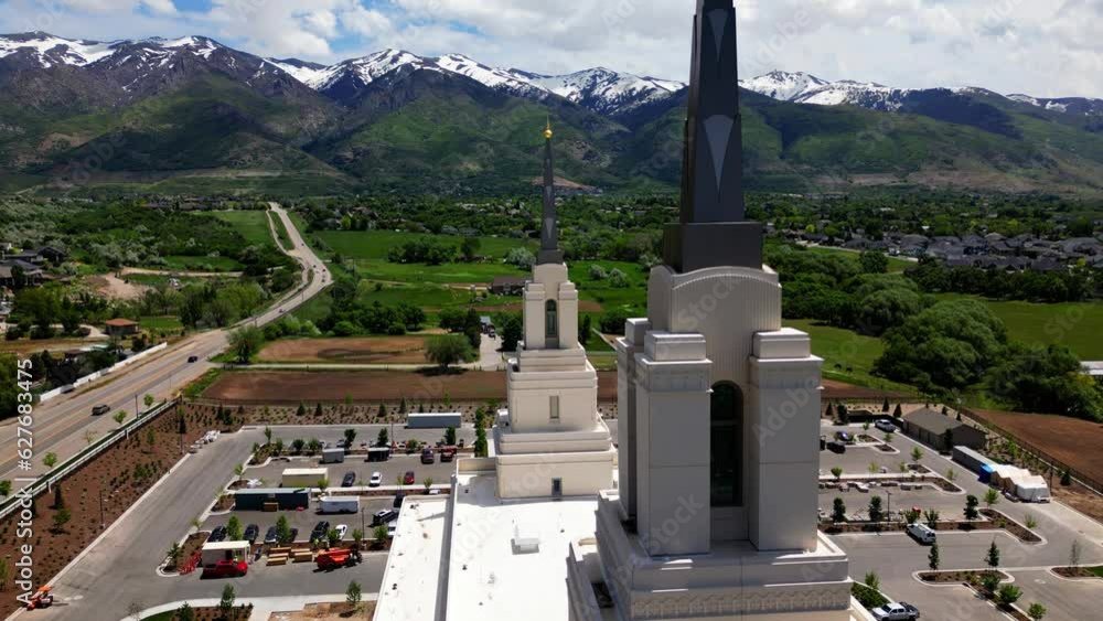 Drone flying up while looking at Layton LDS Mormon Temple steeple ...