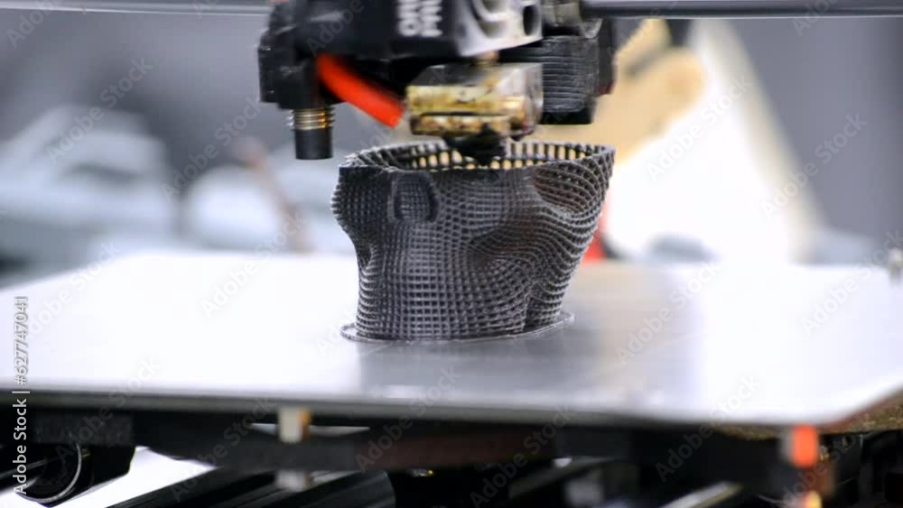 3D printer printing prototype of human skull from molten plastic ...
