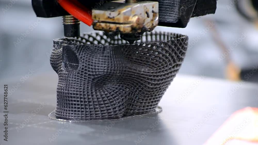 3D printer printing prototype of human skull from molten plastic ...
