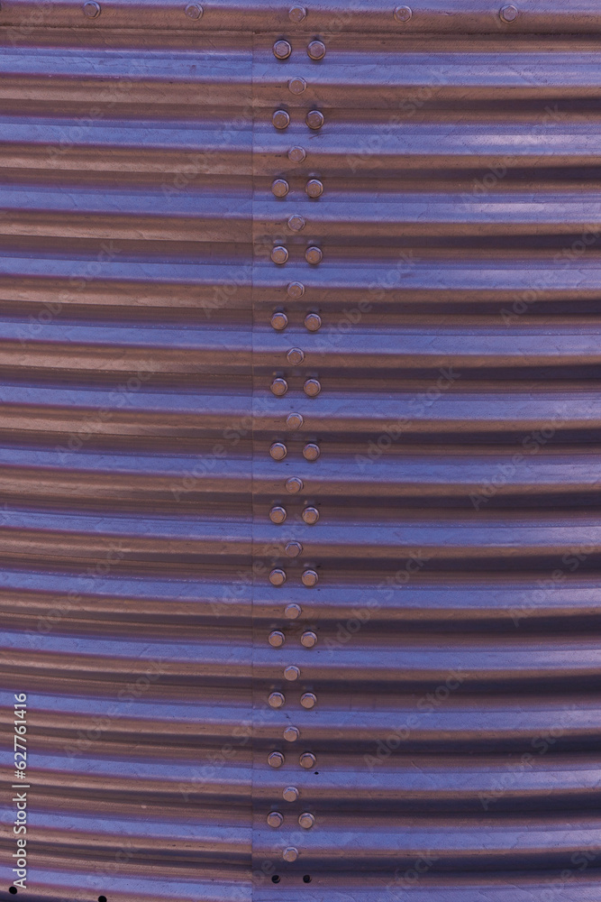 Texture of corrugated metal with fastener and rivets, background for ...