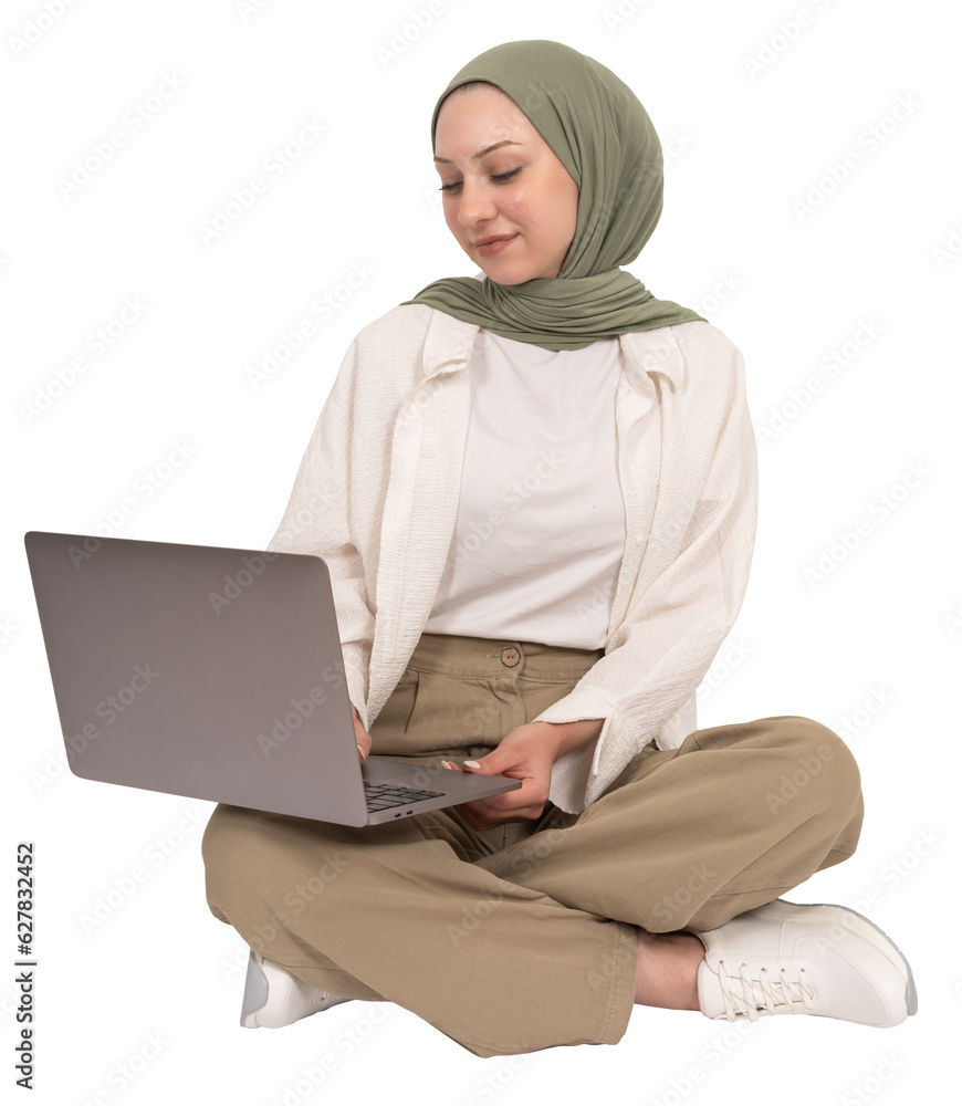 Using laptop, young caucasian university student muslim girl in hijab ...