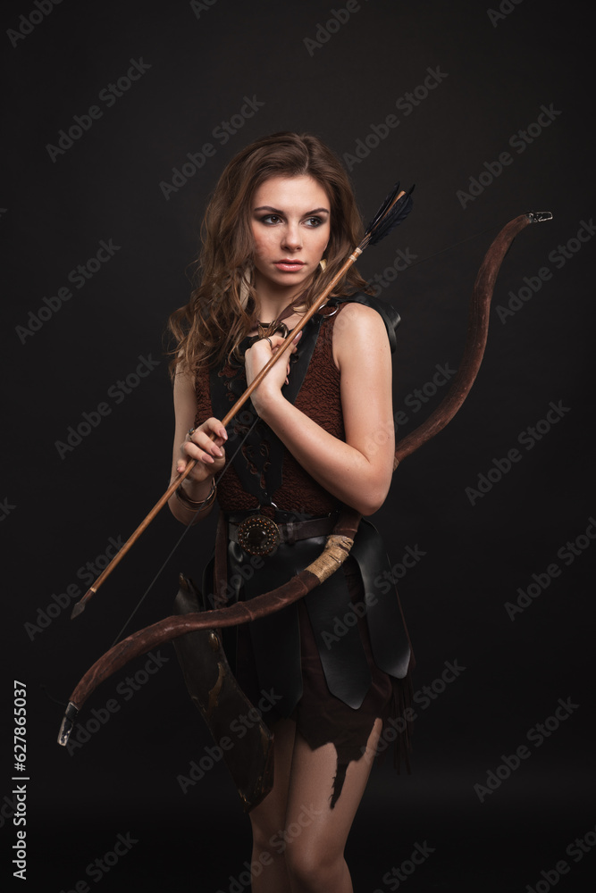 Fantasy archer princess holding bow and arrow. Warrior woman in leather ...
