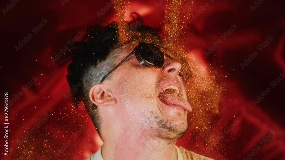 Crazy man sprinkles himself with sparkle particles. Fun video, funny ...