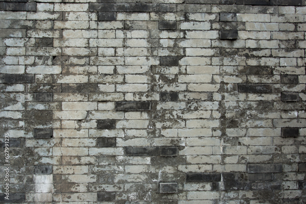 old grey bick wall with protuding and worn segments details background ...