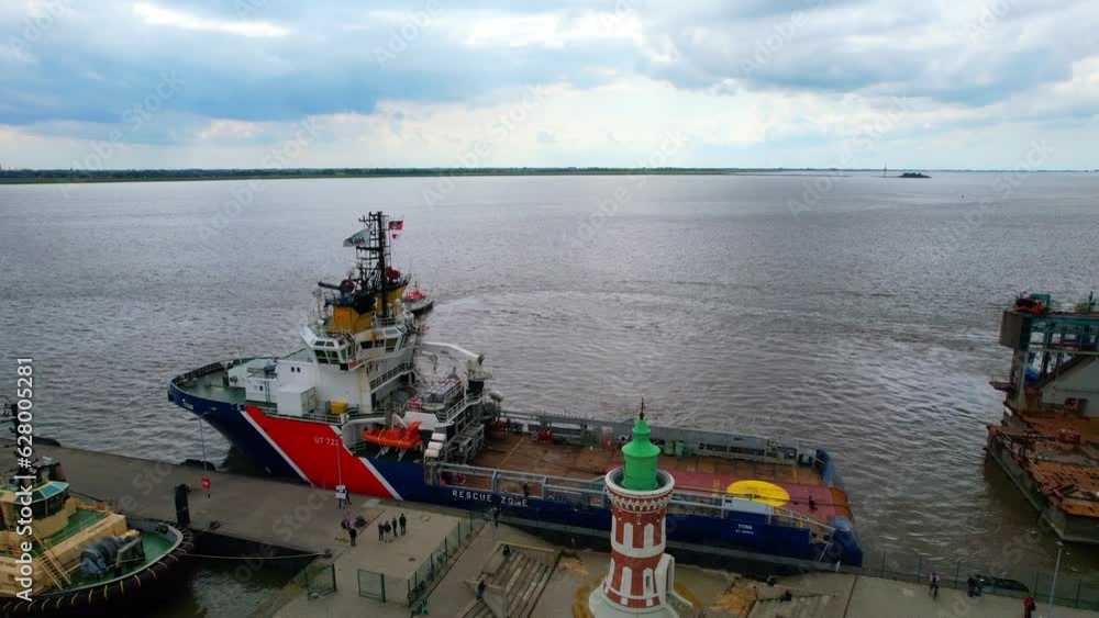 Bremerhaven - ship dock is pulled by the deep-sea tugboat - an aerial ...