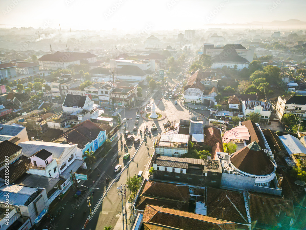 Aerial view of Tugu Jogja or Tugu Pal with crowded vehicles traffic in ...