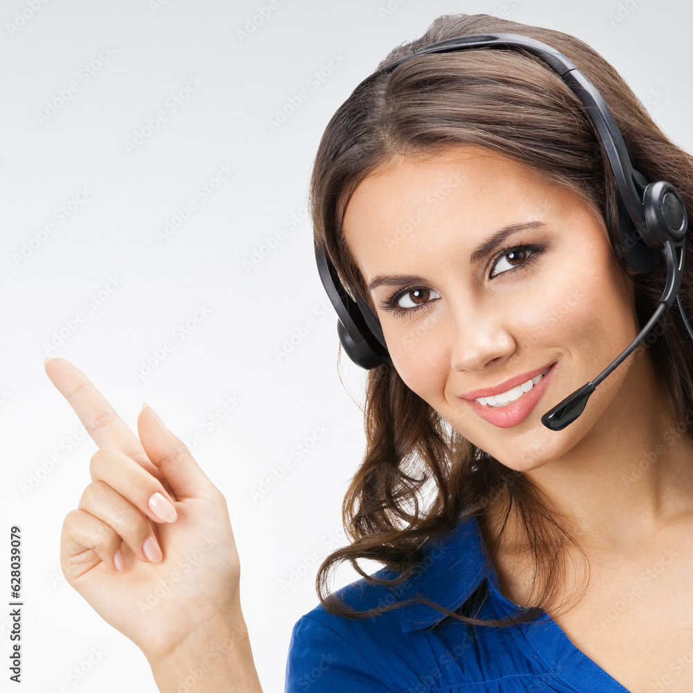 Portrait of happy smiling beautiful young support phone operator ...