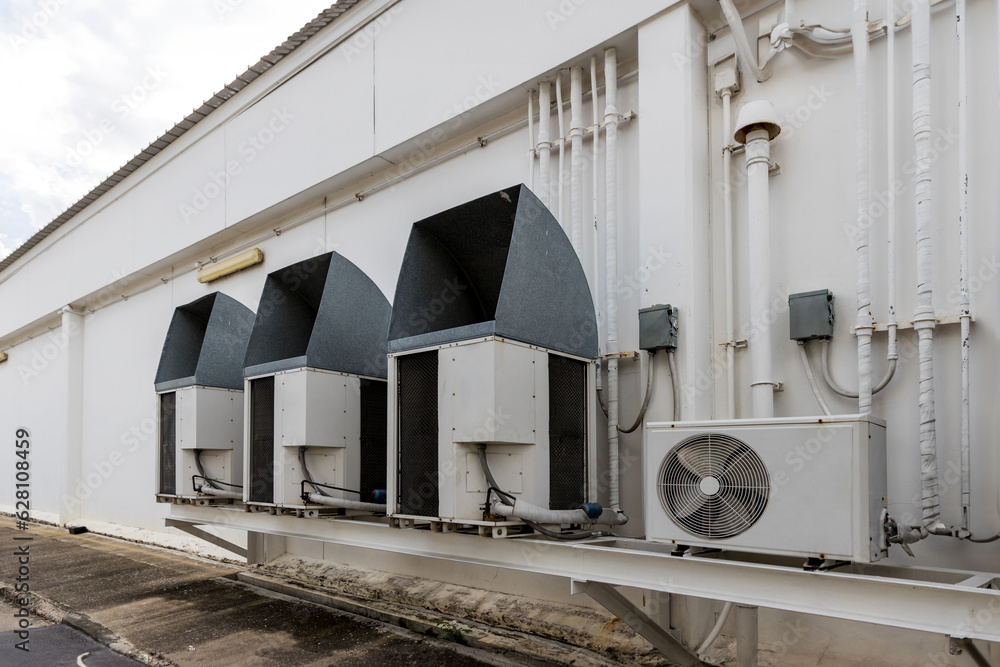 Air conditioner compressor installed in old building. Outdoor split ...