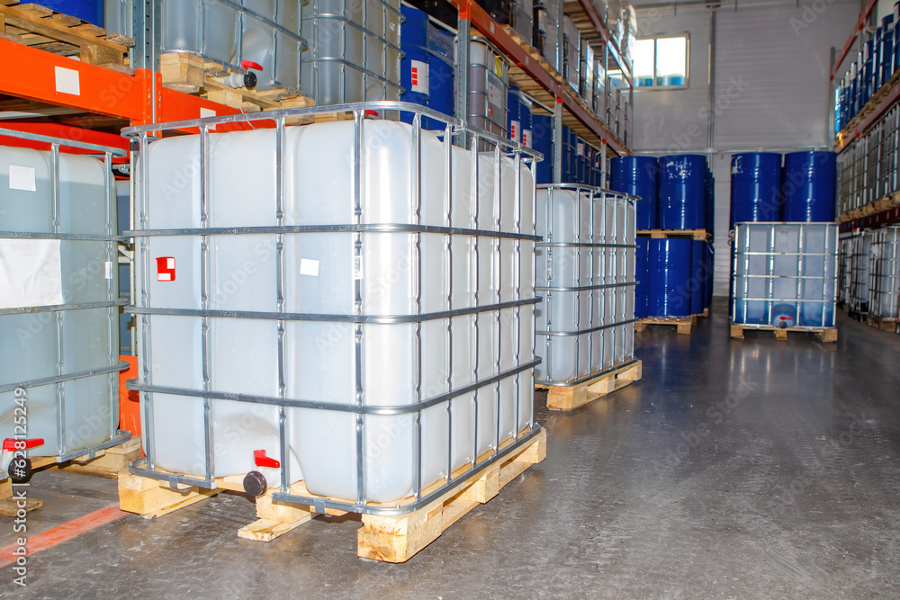 Warehouse of chemical company. Barrel storage. Pallets with containers ...