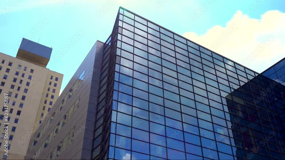 Tall big office builidings, exterior view on the white clouds with blue ...