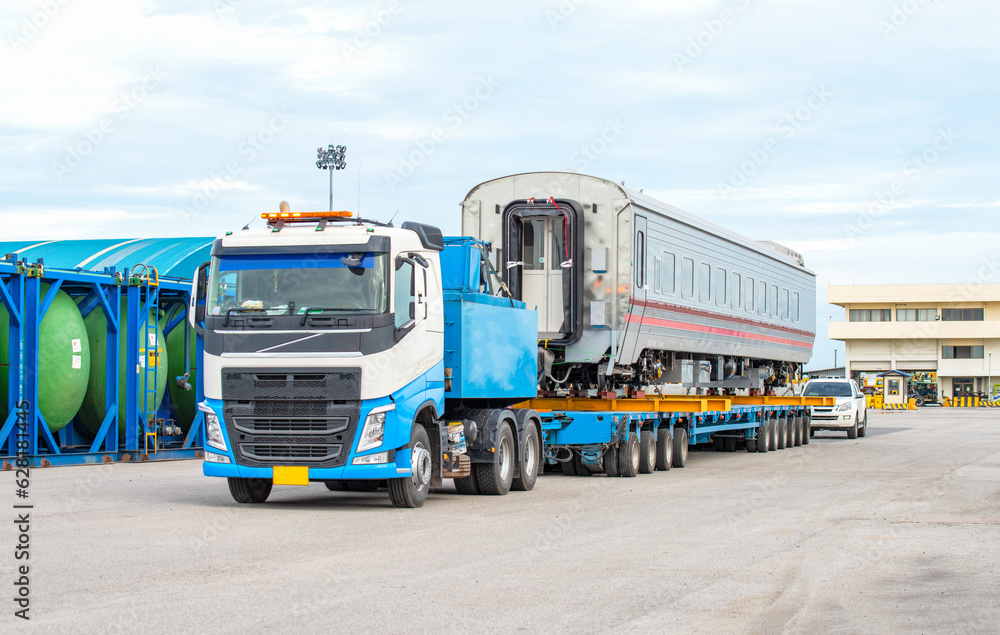 Transport of Oversize Heavy cargo trailera new passenger train on a ...