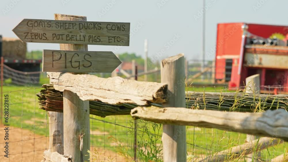 Sign directions at the gate of animal feeding farm, Goats, Sheep, Ducks ...