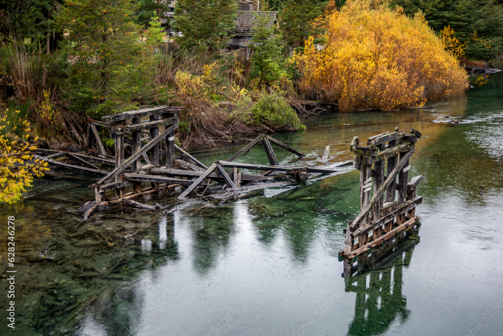 View of the remains of the old wooden bridge that crossed the Ruca ...