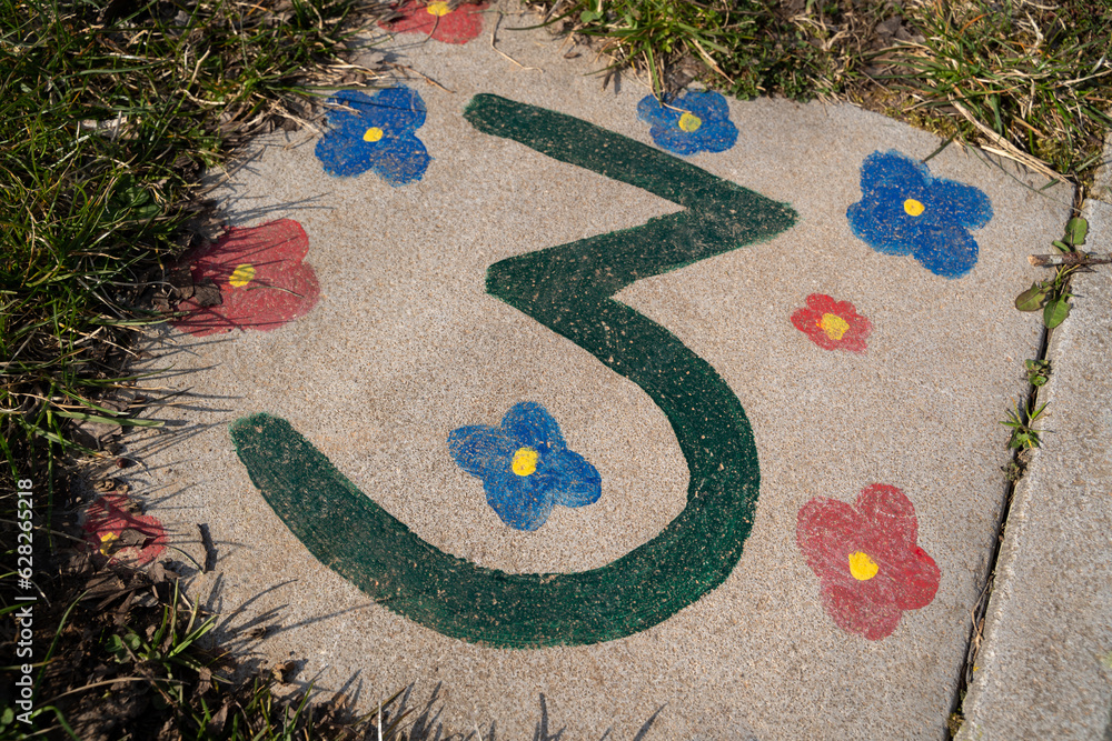 Hopscotch game painted by children on the playground with a green ...