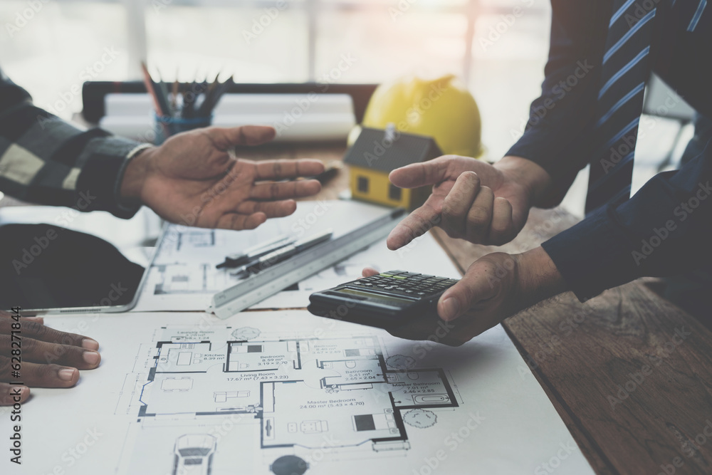 Foto de Structural engineer team discussing and calculating work Office ...