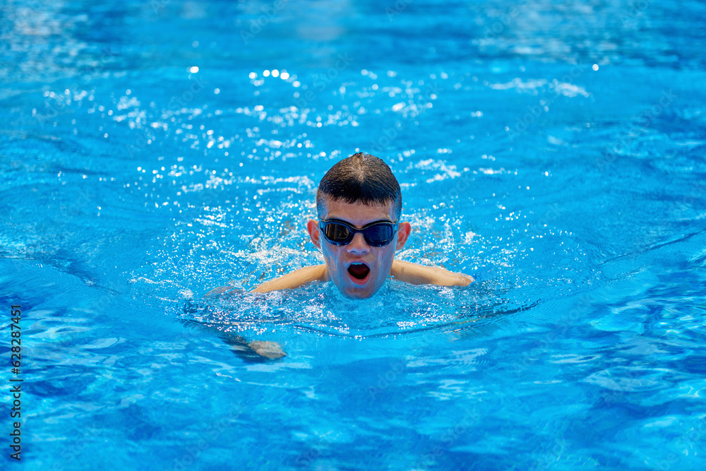 Fit swimmer training in the swimming pool. An overhead view of a man ...
