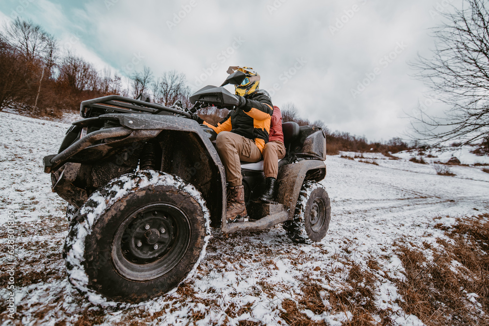 A young adventurous couple embraces the joy of love and thrill as they ...