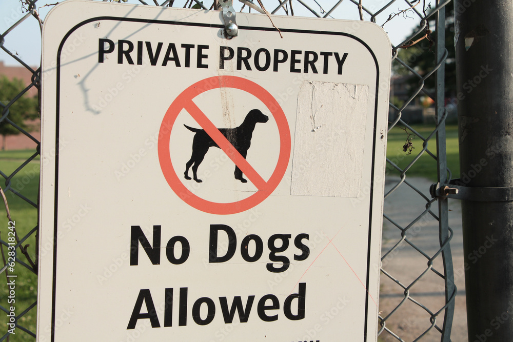 private property no dogs allowed sign in black writing on white ...