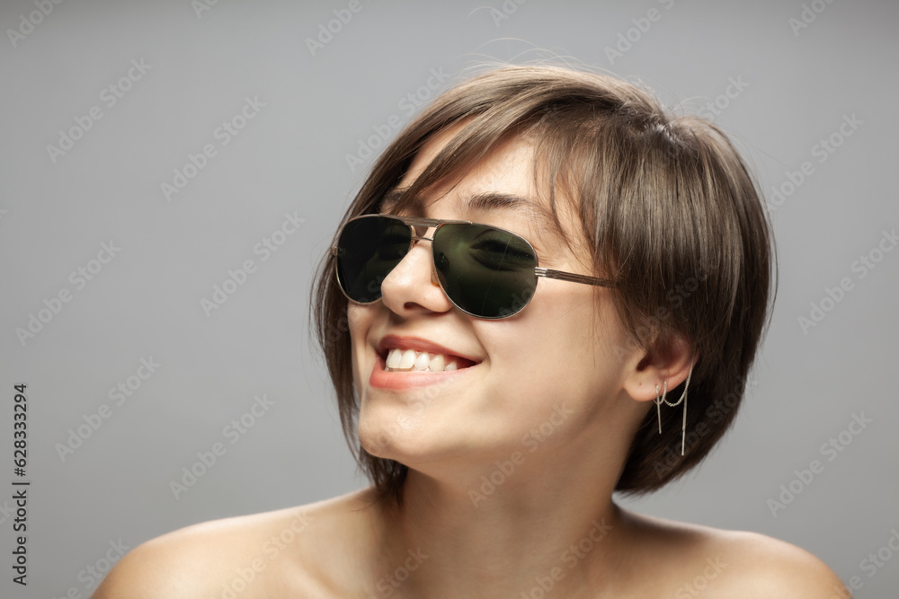 Beautiful girl fashion portrait wearing sunglasses. Happy smiling face ...