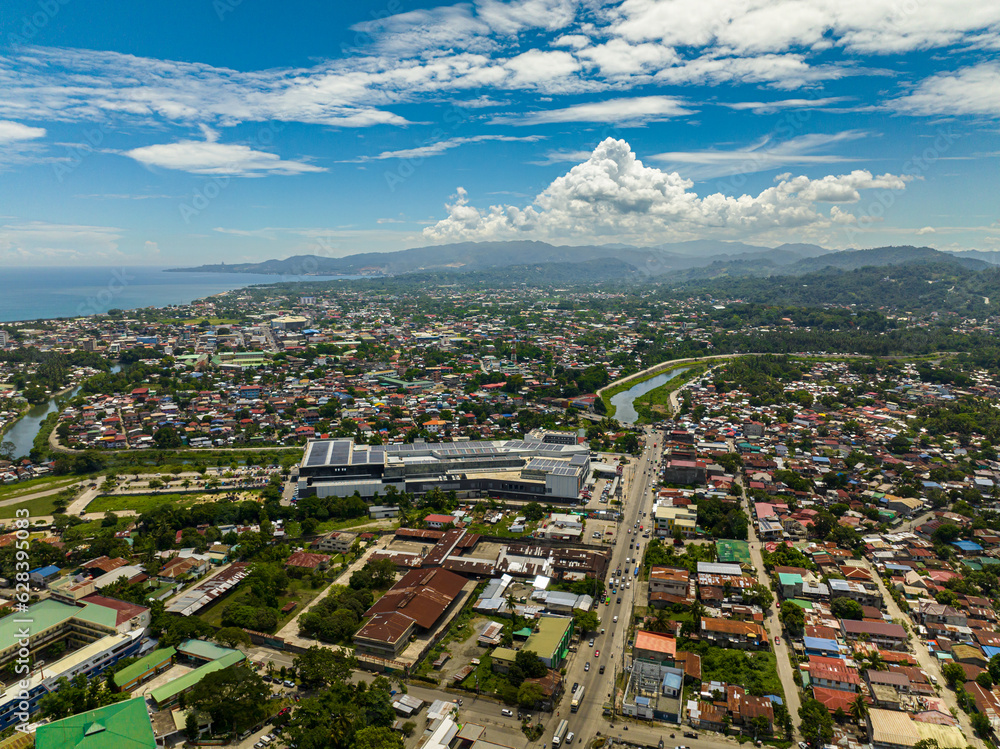 Aerial survey of Iligan City with modern and commercial buildings ...