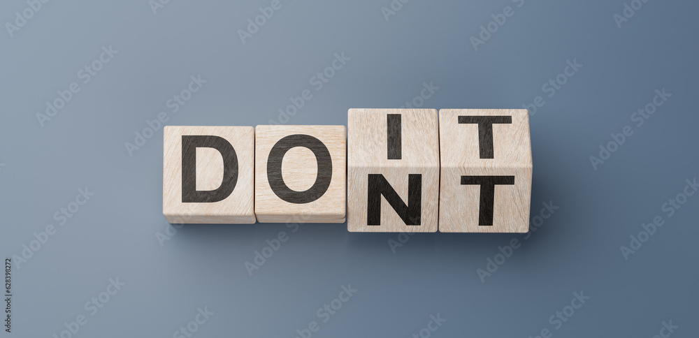 Doit or dont. flip wooden cube block with word dont change to do it ...