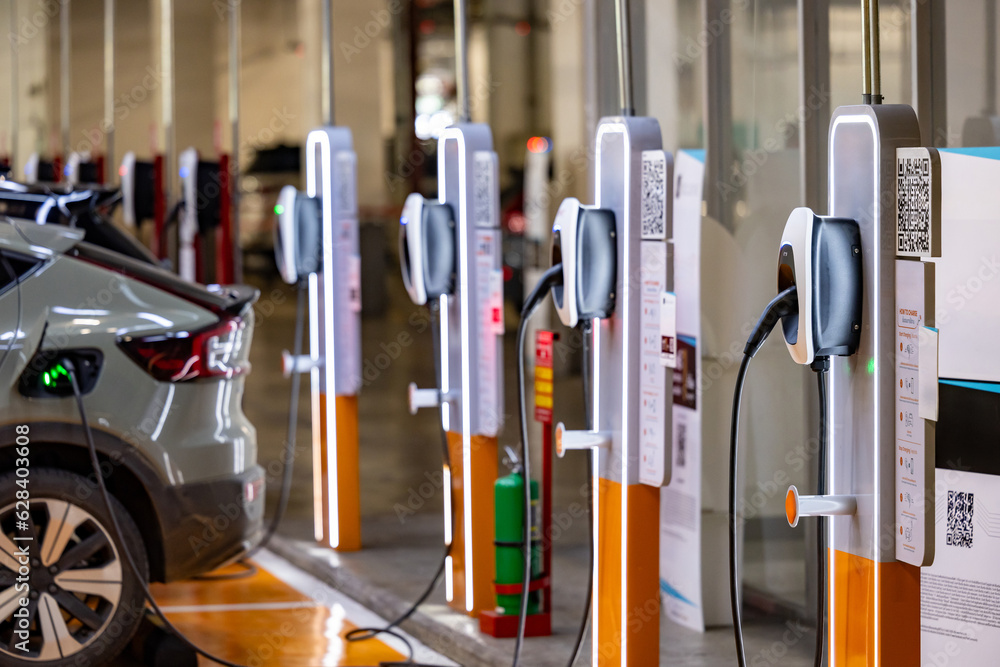 EV charging an electric car.Power supply for electric car charging ...