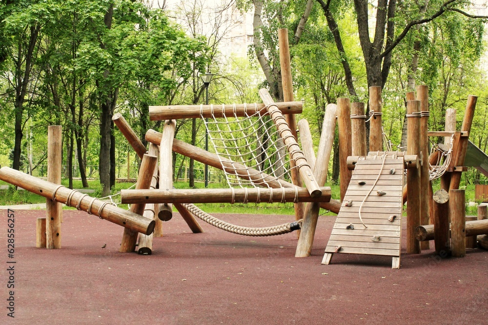 Wooden playground made of natural eco-friendly material in public city ...
