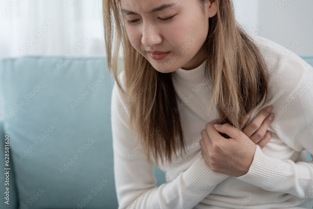 hand hold chest with heart attack symptoms, asian woman have chest pain ...
