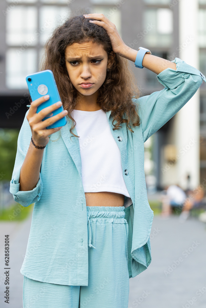 Pretty preteen child kid use smartphone typing browsing, loses becoming ...