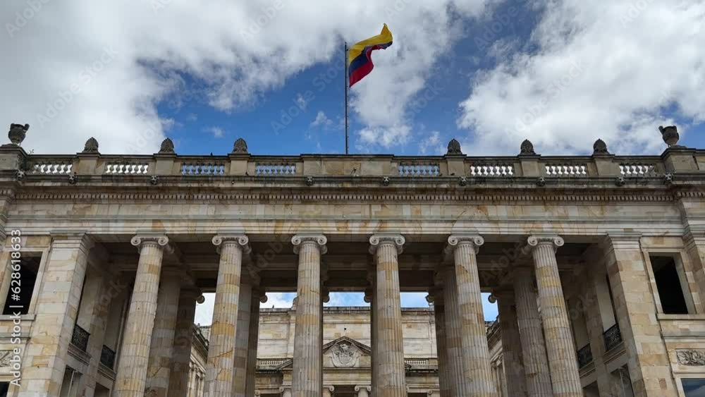 facade of the Senate of the Republic of Colombia with the flag waving ...