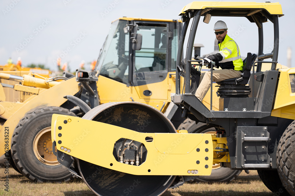busy worker man in construction equipment. construction worker drive ...