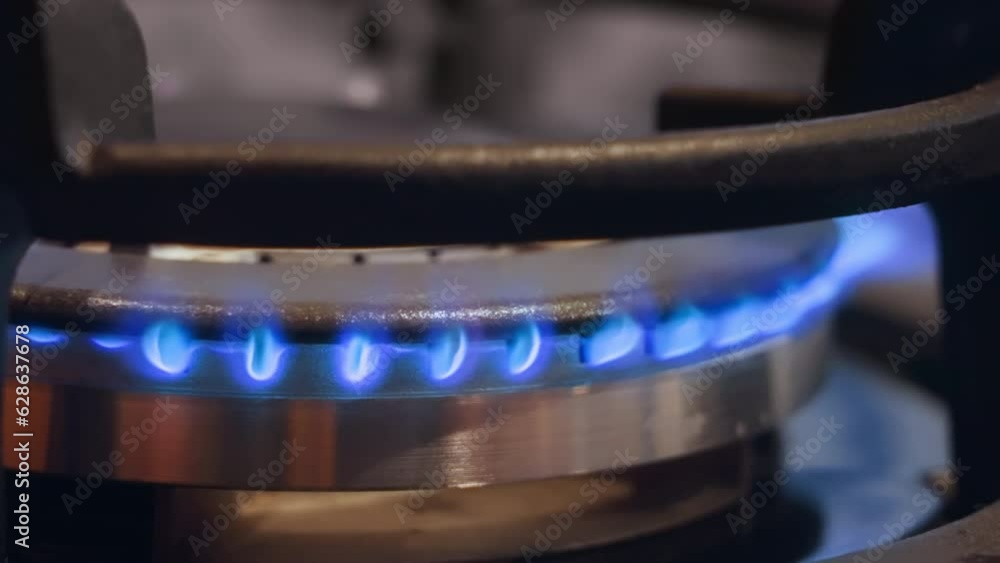 Close-up view of blue flame appearing from vintage old gas stove. Fire ...