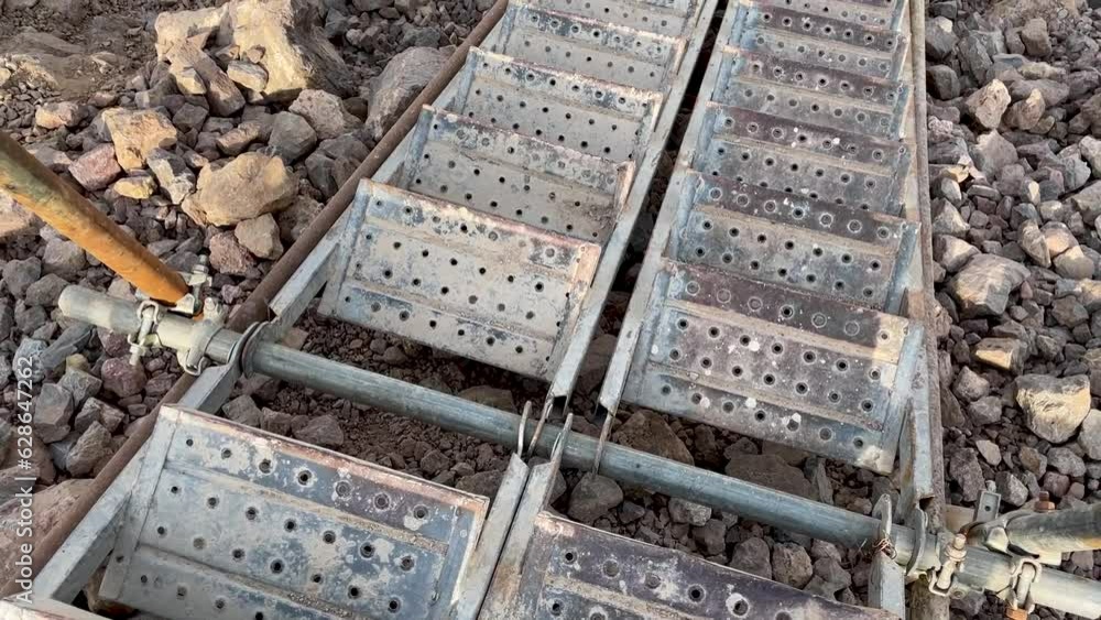 scaffold stair installed on a dirt slope in a mining quarry Stock Video ...
