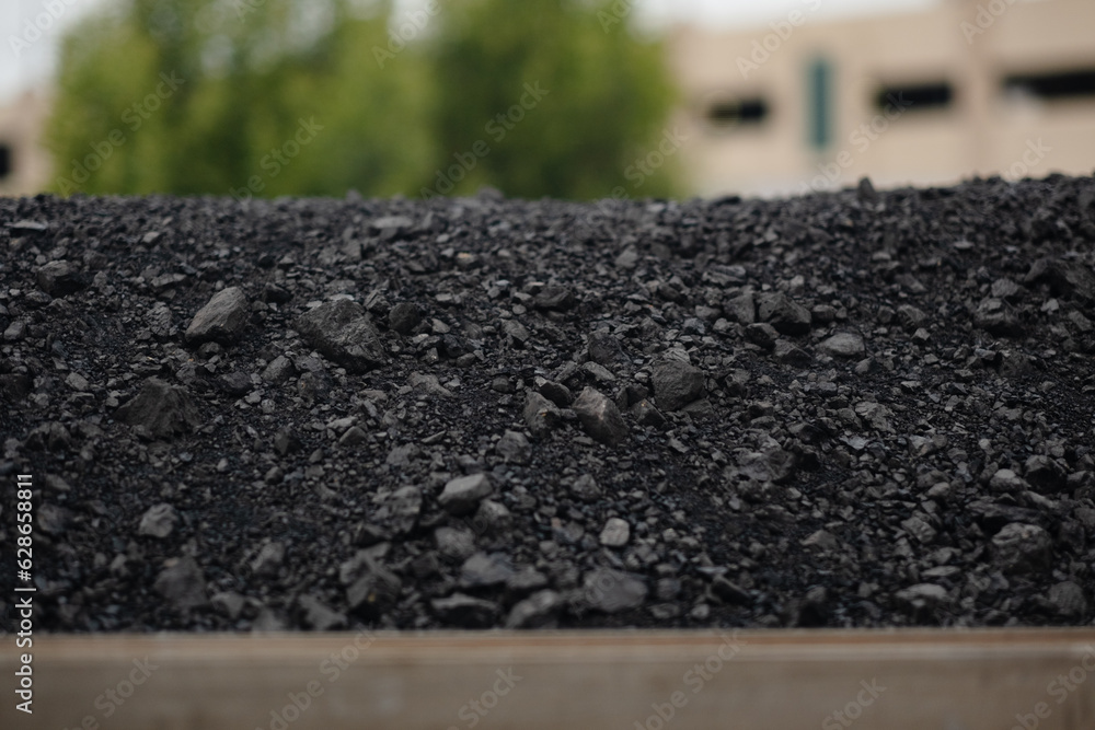 A train car filled with a heaping pile of phosphate rock, a key soil ...